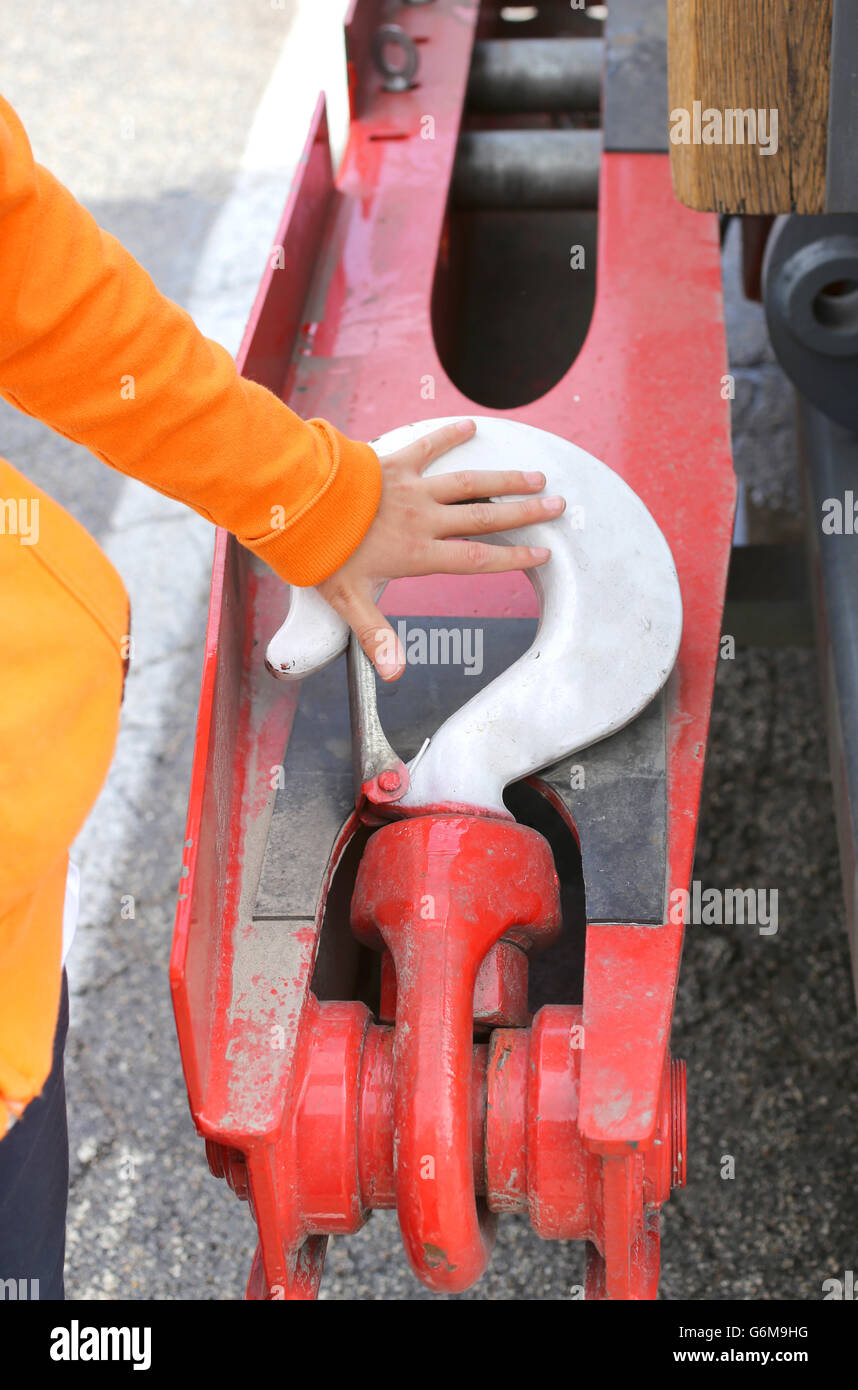 large hook installed on trucks of firefighters and hand the curious ...