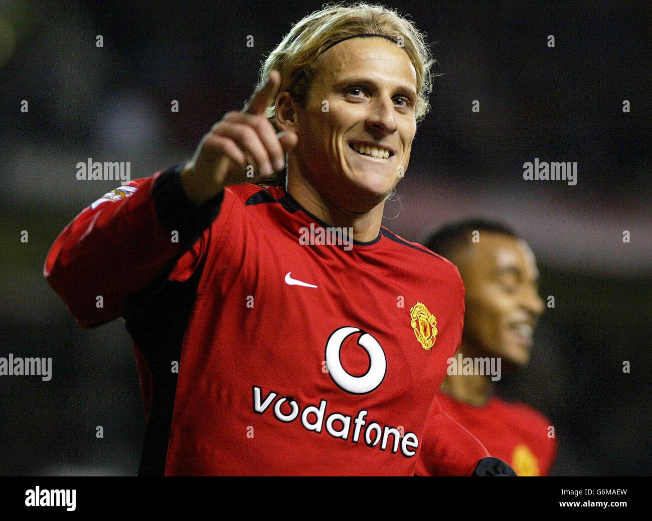 Manchester United's Diego Forlan celebrates scoring the third goal ...