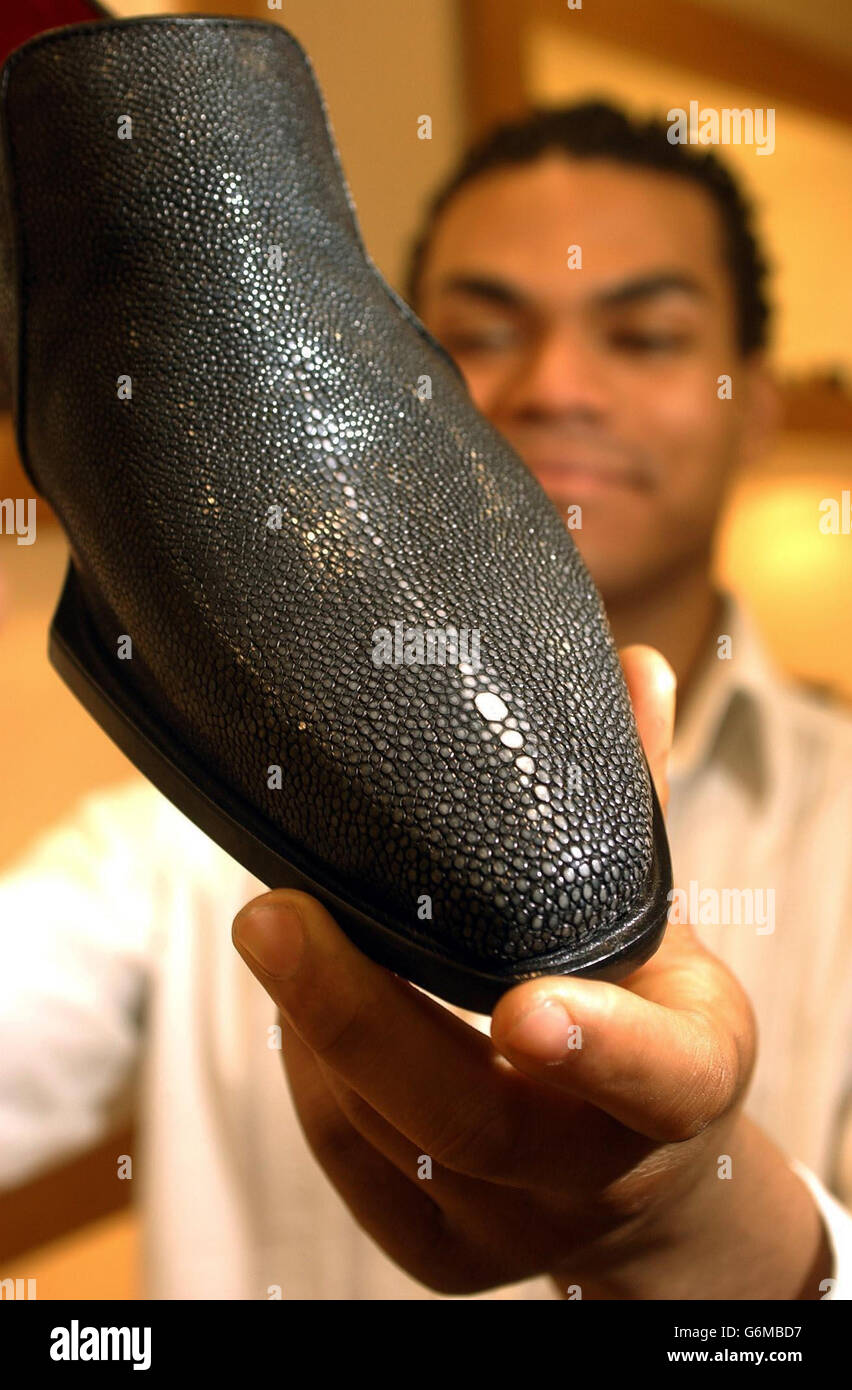 A shop assistant holds a Stingray skinned shoe which sell for 750 a ...