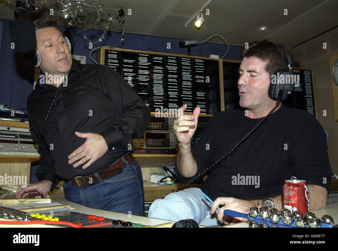 Presenter of the show, DJ Neil Fox (left) and guest Simon Cowell ...