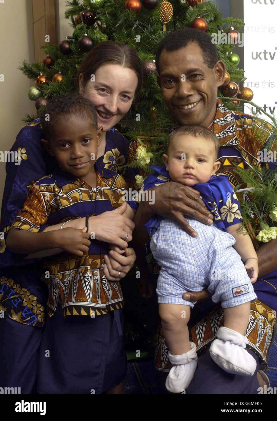 Joanne Rymell and her husband Epi pose for photographers with their two ...