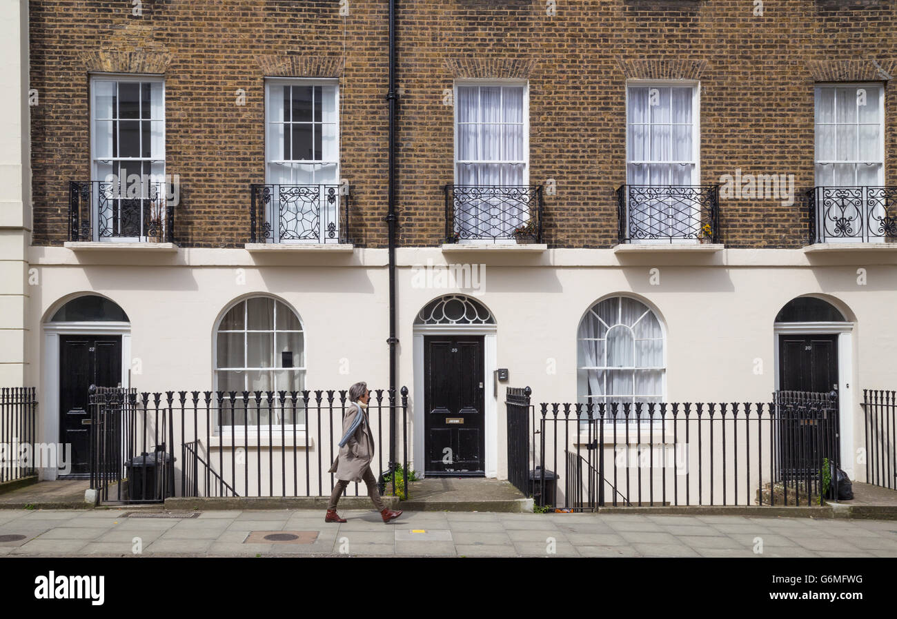 terraced street of early Victorian town houses in central London with ...