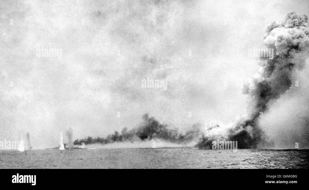 HMS Queen Mary (right) blowing up, and (left) HMS Lion with German ...