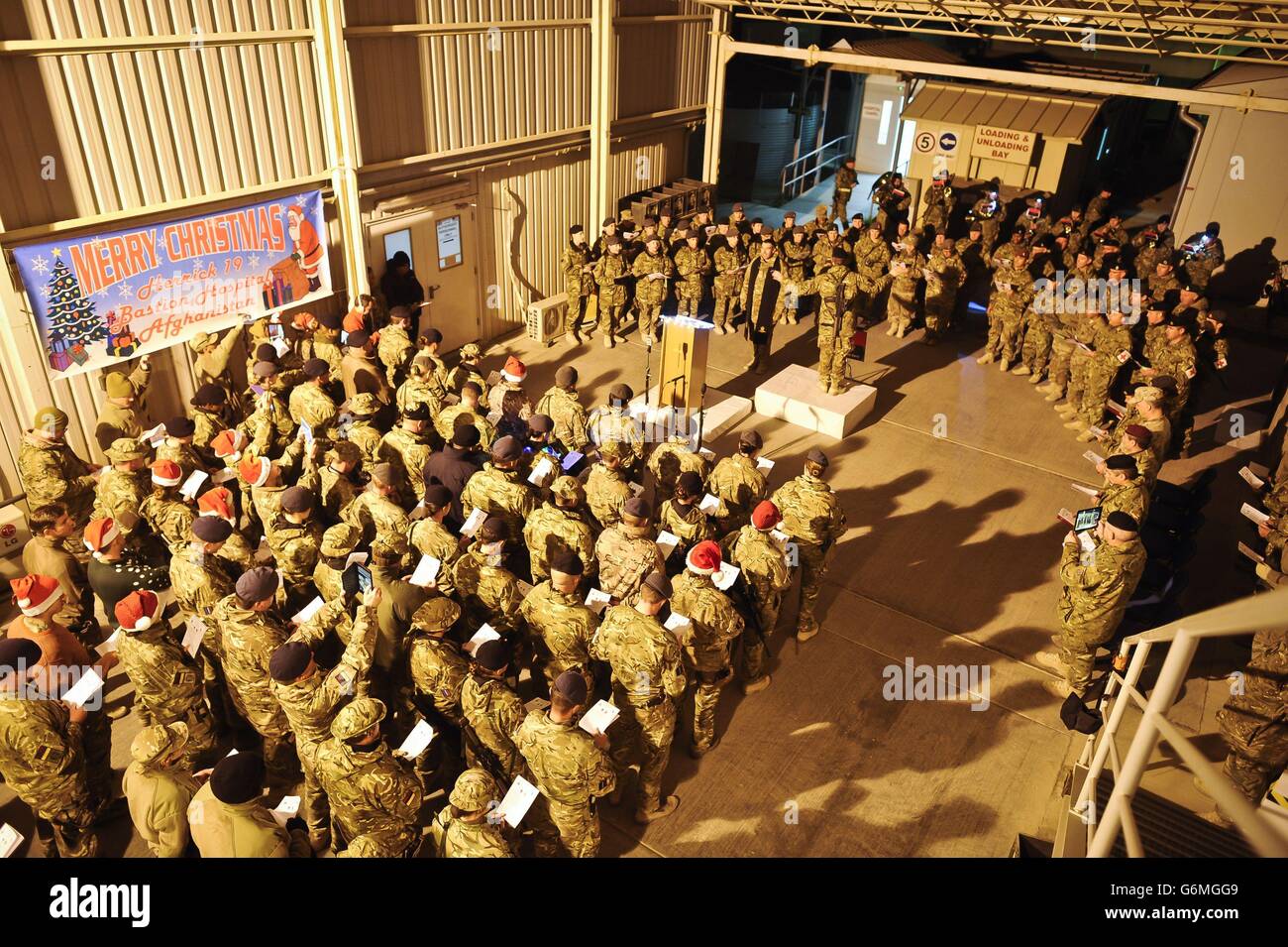 Soldiers gather at Camp Bastion field hospital, Afghanistan, for a ...