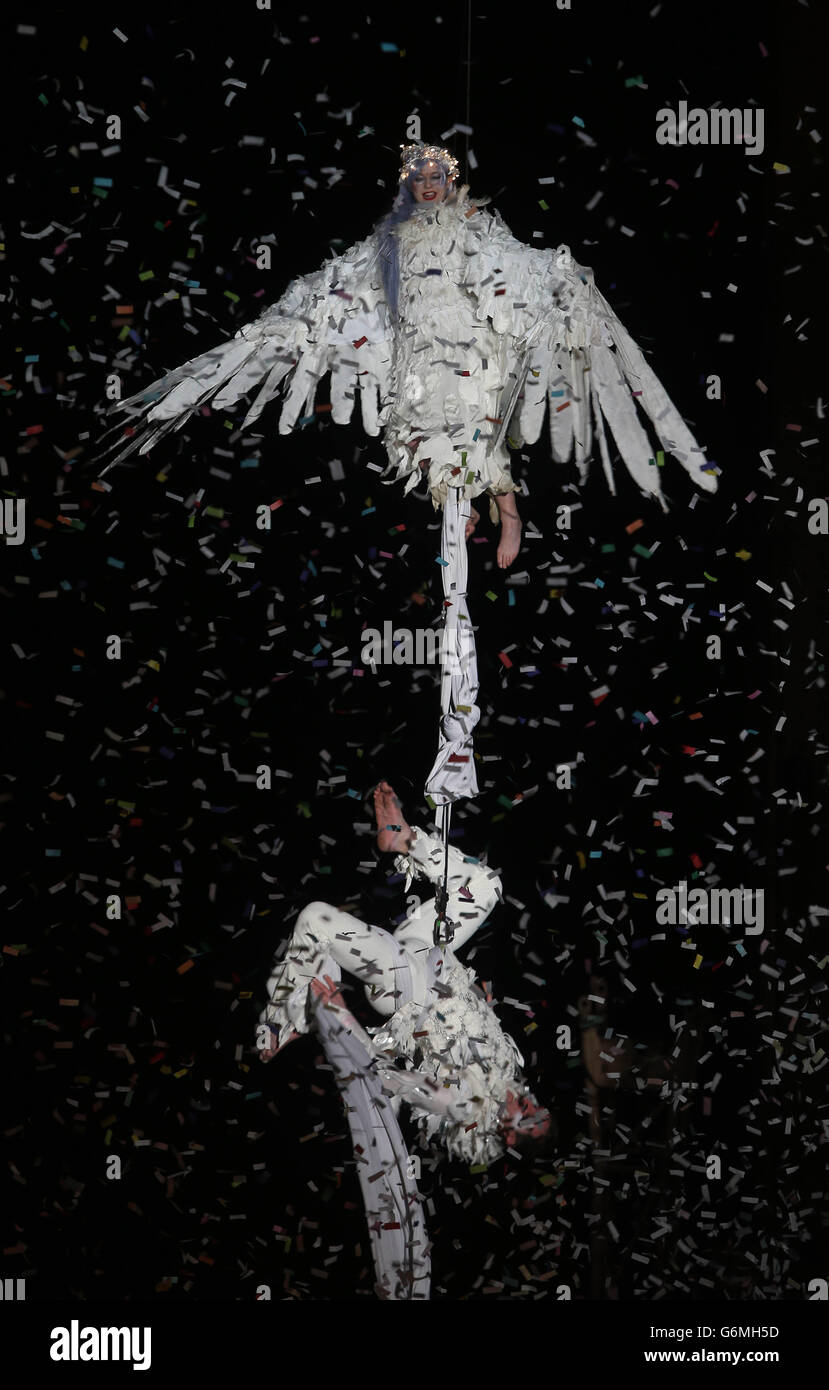 Atmospheric torch lit procession illuminating its way through city hi ...