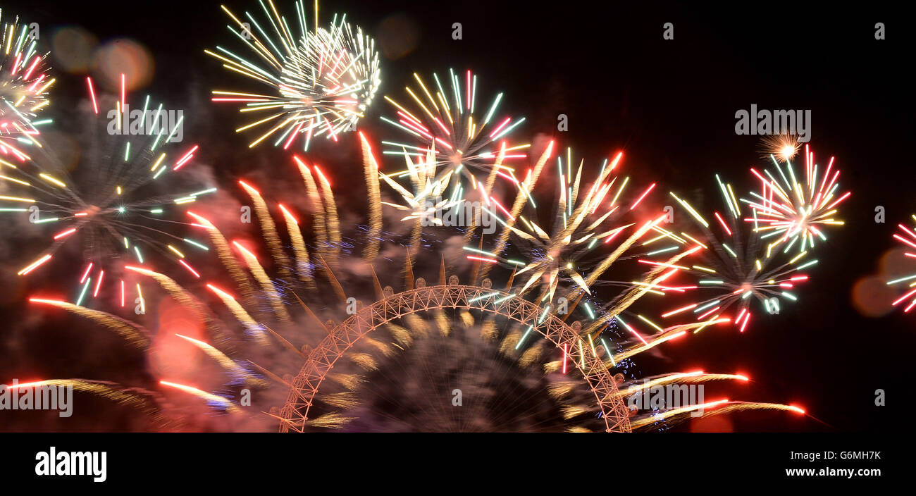 Fireworks light up the sky over the London Eye in central London during ...