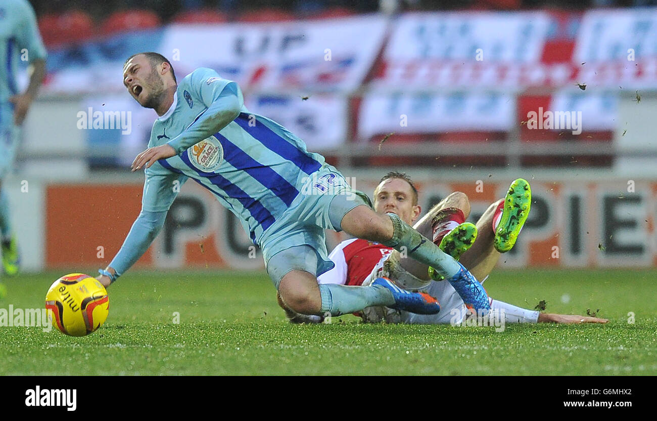 Coventry City's Billy Daniels is tackled by Rotherham United's Robert ...
