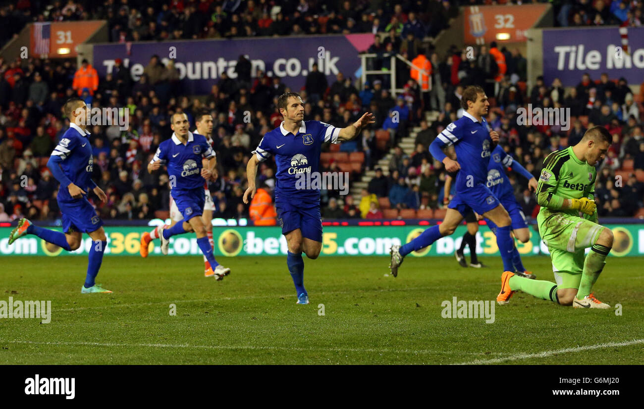 Everton's Leighton Baines (centre) celebrates scoring his sides ...