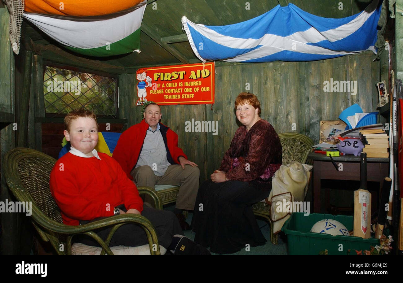 Jackson family in their playhouse Stock Photo - Alamy