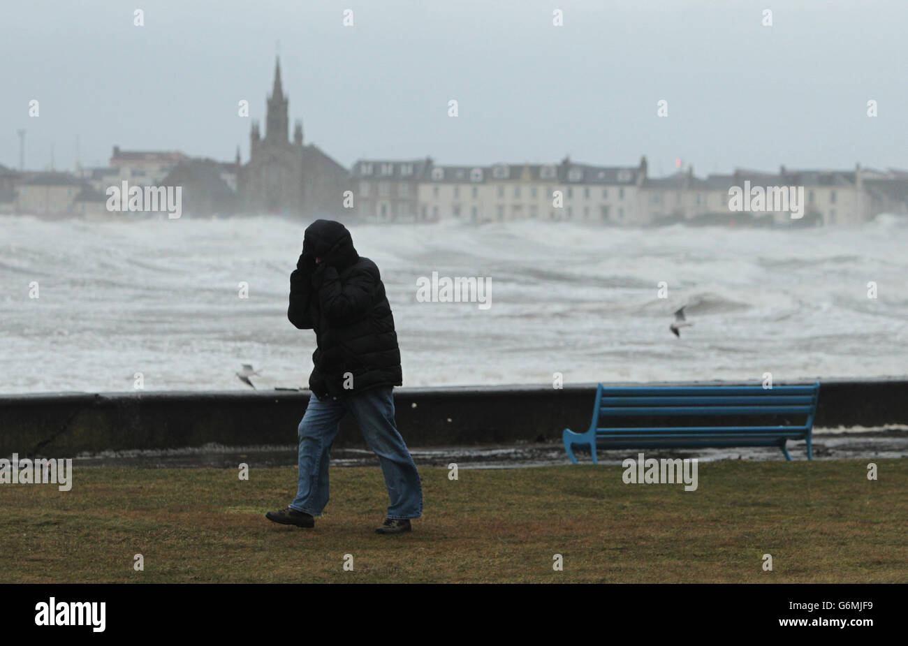 A person on battles the weather in Ardrossan, Scotland as Britain is ...