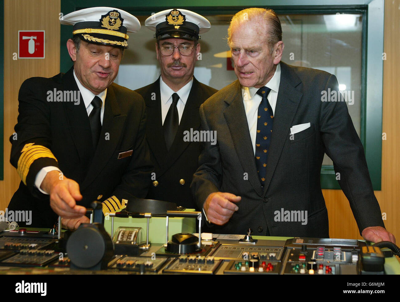 The Duke of Edinburgh on the bridge with Capt Paul Wright (left) and ...