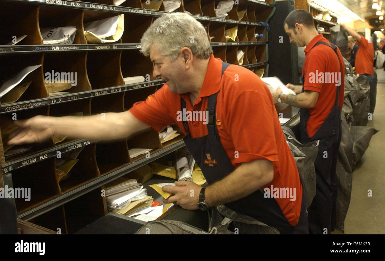 Workers on the Travelling Post Office sort mail destined for the north ...