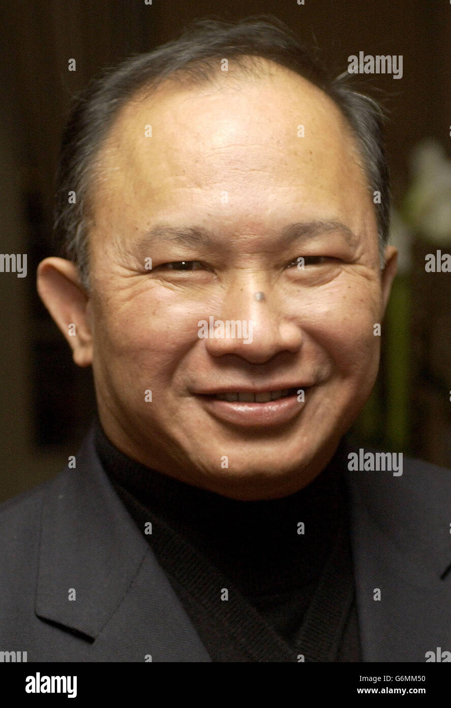 Director John Woo arrives for the screening of his latest film Paycheck ...