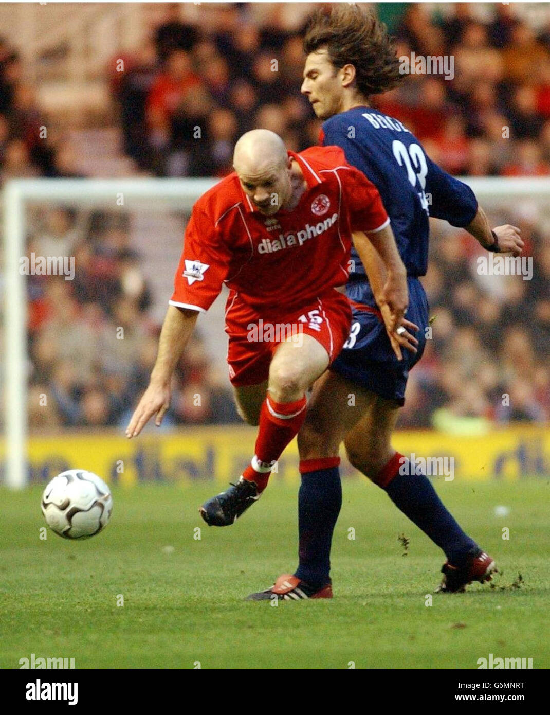Danny Mills (left) of Middlesbrough gets past Portsmouth's Patrick ...