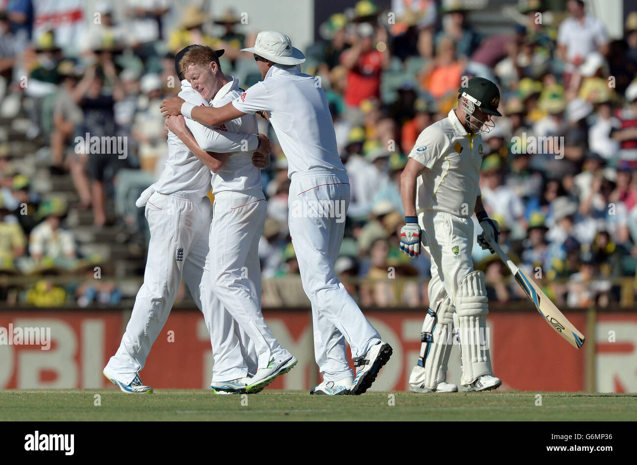 England's Ben Stokes (second left) celebrates with Graeme Swann (left ...