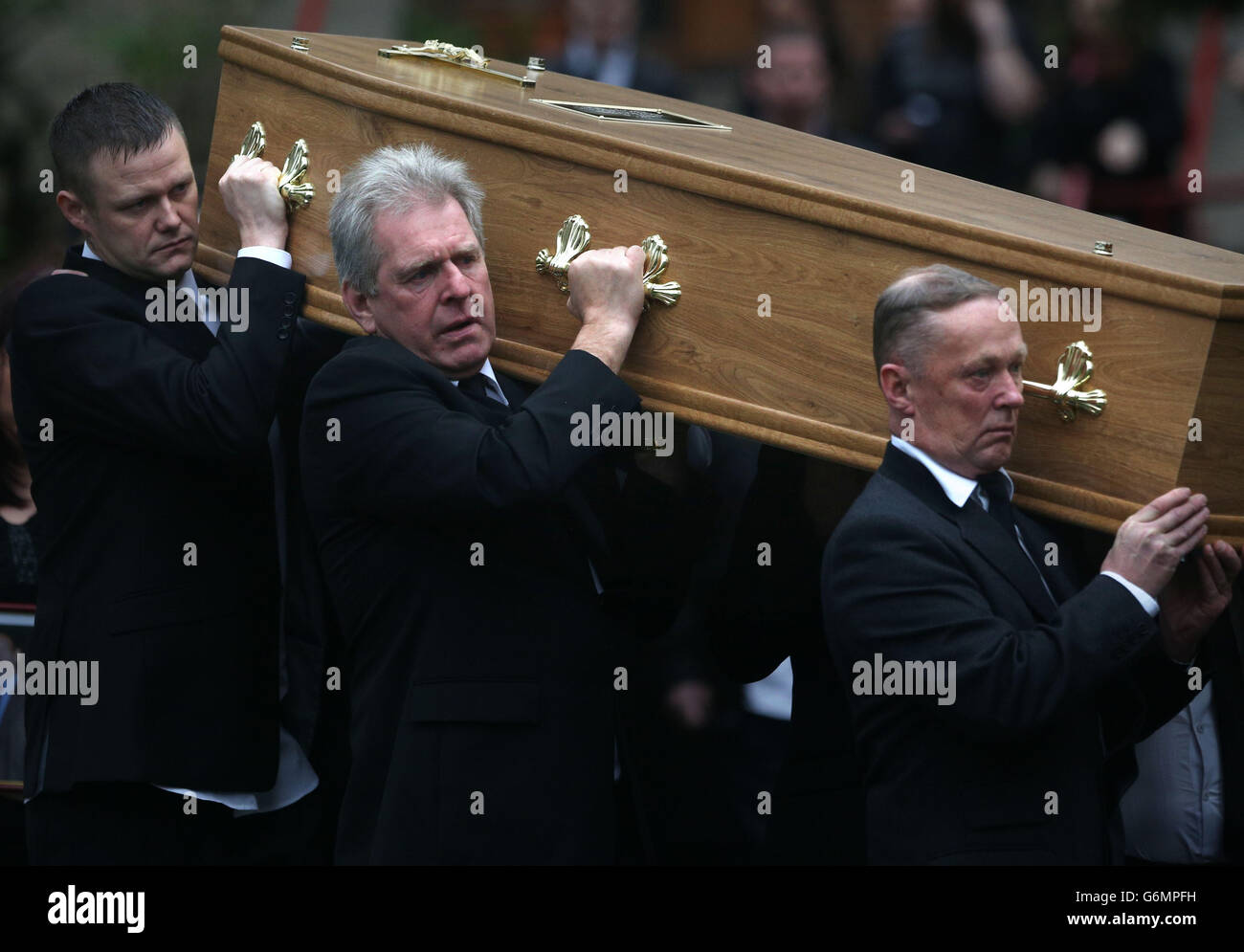 The coffin of Samuel McGhee, who died when a police helicopter crashed ...