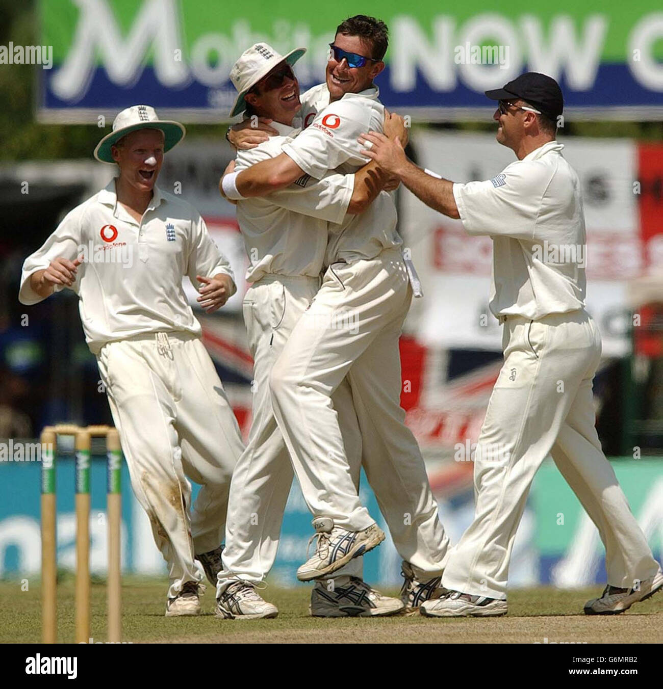 England bowler Ashley Giles (inside right) celebrates taking the wicket ...