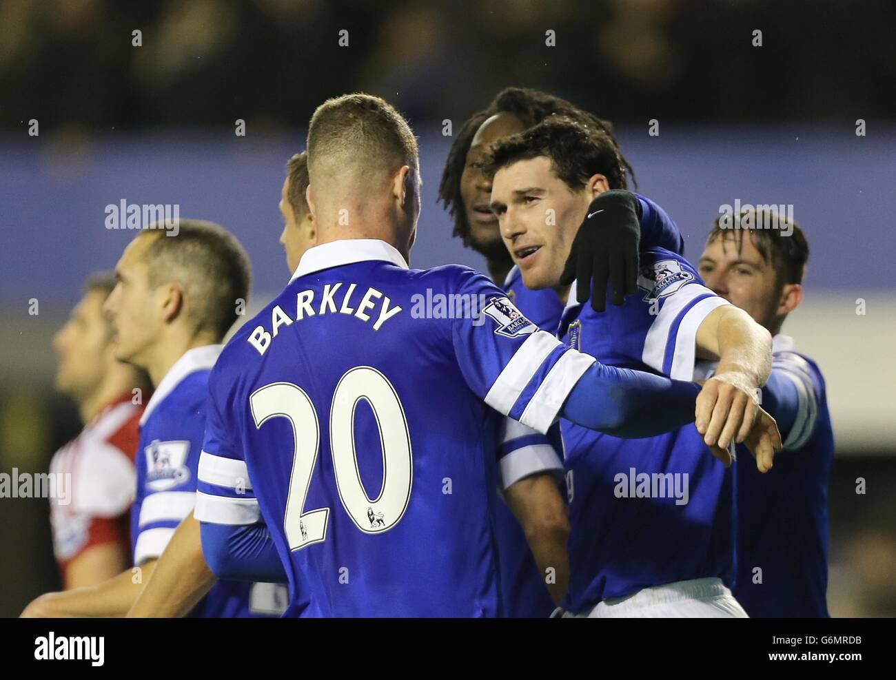 Everton's Gareth Barry (right) celebrates scoring his teams third goal ...