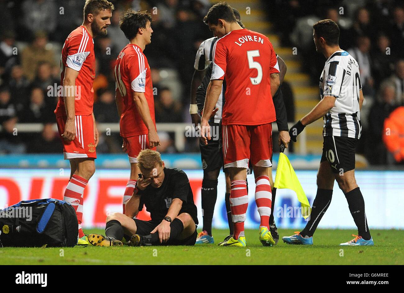 Referee Mike Jones ends up grounded after an accidental collison with ...