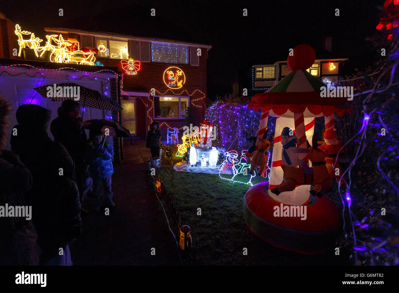 Visitors enjoying the first night of the Christmas lights adorning ...