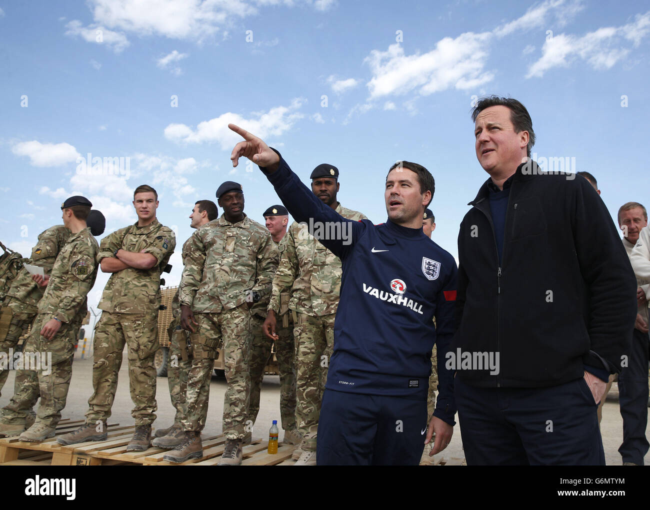 Prime Minister David Cameron stands with former England footballer ...