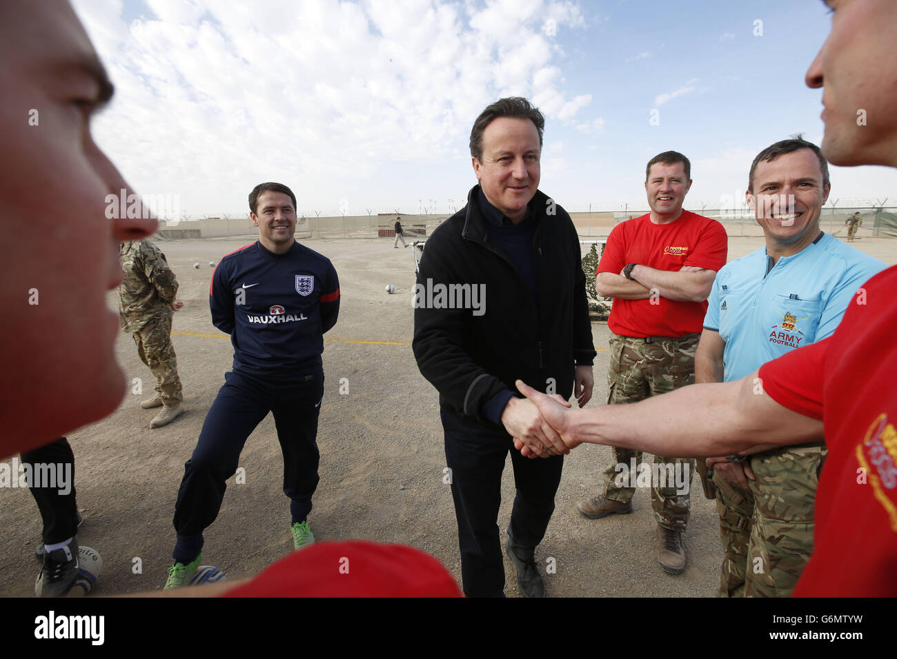 Prime Minister David Cameron stands with former England footballer ...
