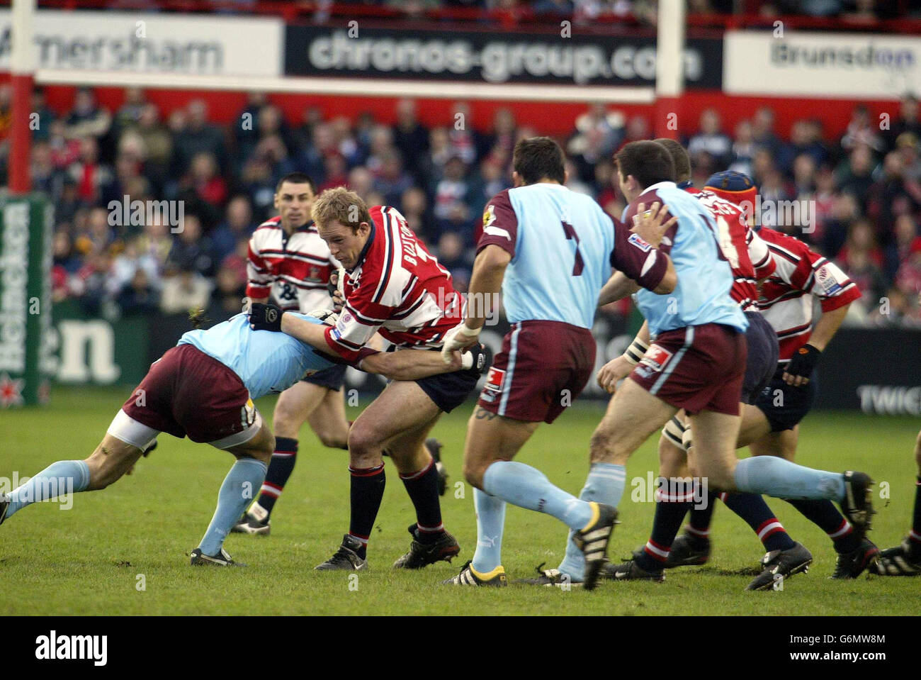 Gloucestershire's Peter Buxton is held up by a Bourgoin player, during ...