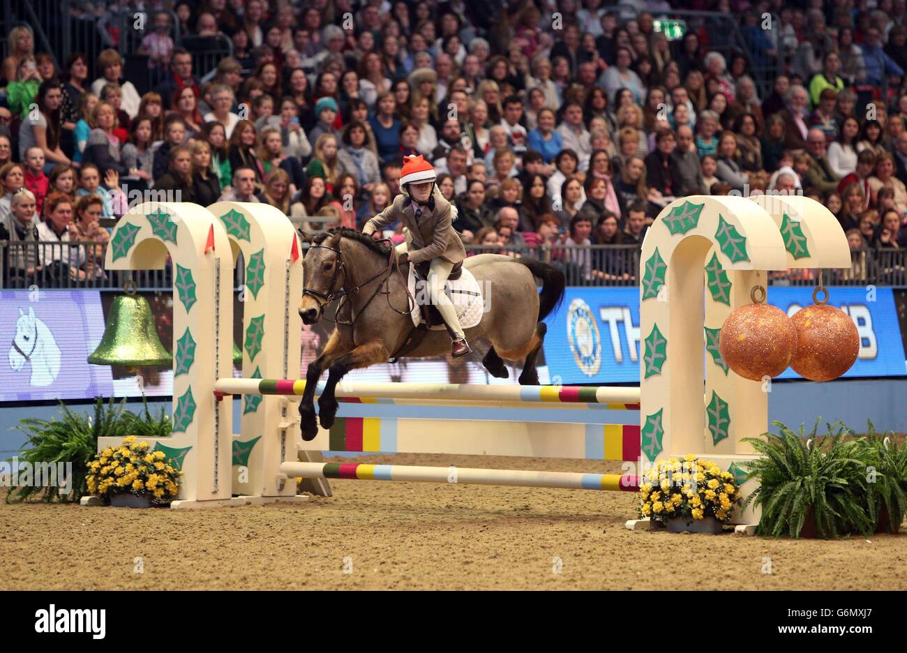 Great Britain's Cerys Howell riding Runaway Dolly jumps a fence in the ...