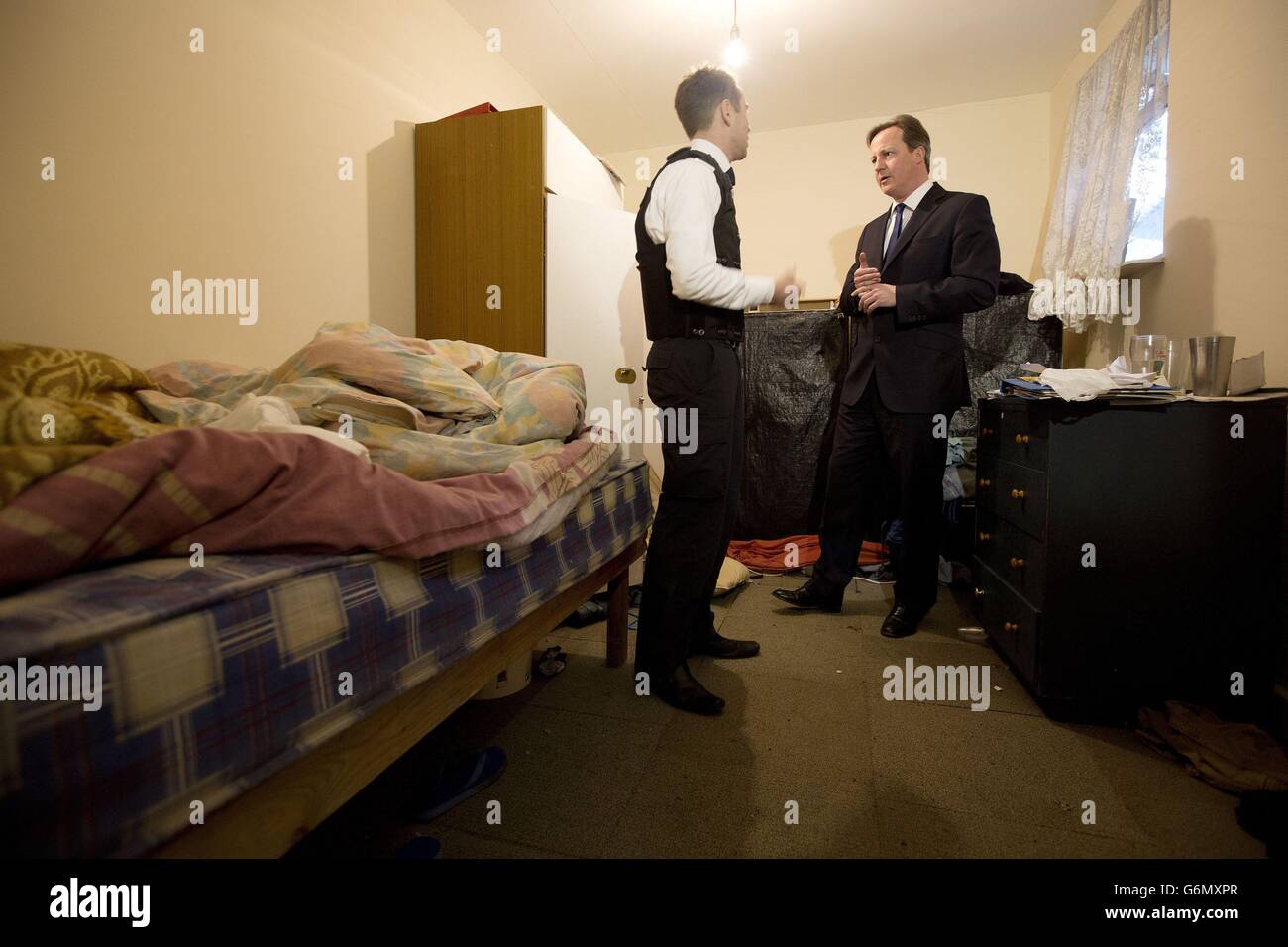 Immigration officer Paul Wylie shows Prime Minister David Cameron ...