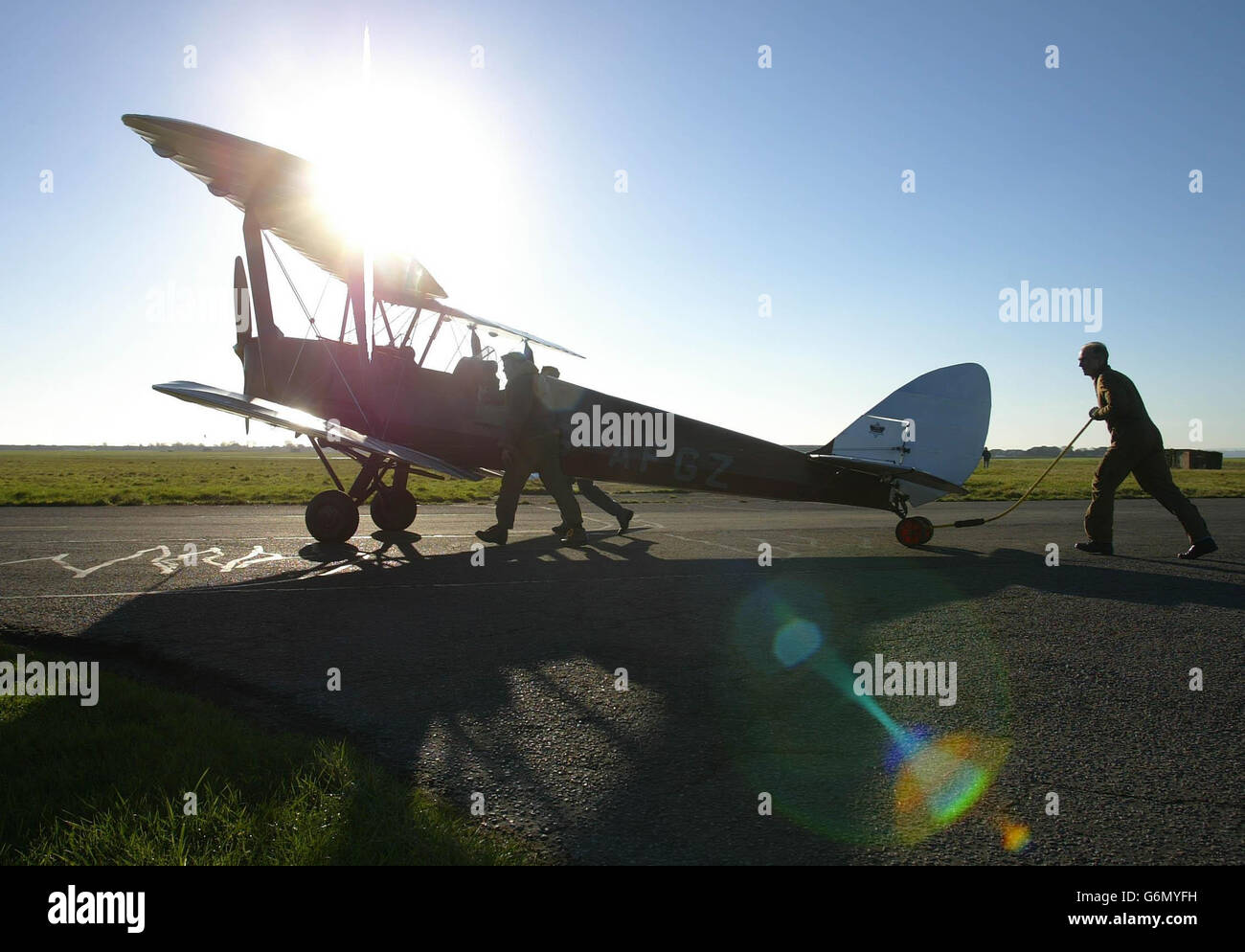 Pilot Malcolm Paul prepares his 1937 Tiger Moth at HMS Daedalus ...