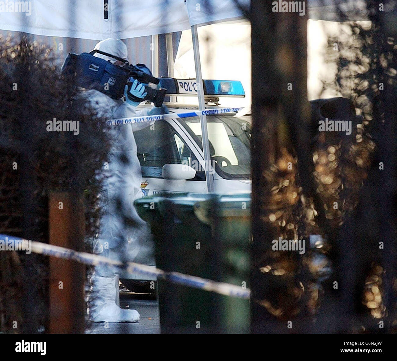 Searching the crime scene Stock Photo - Alamy