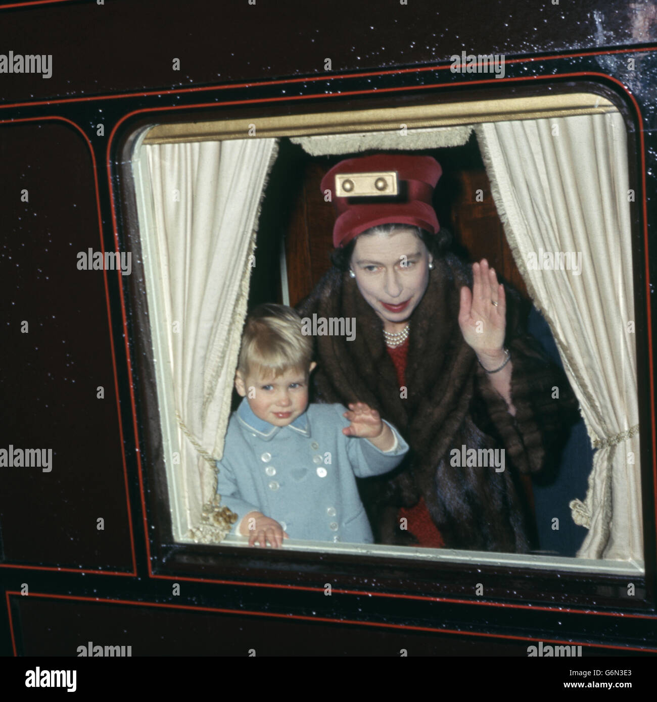 The Queen waves from a carriage window with Prince Edward Stock Photo ...