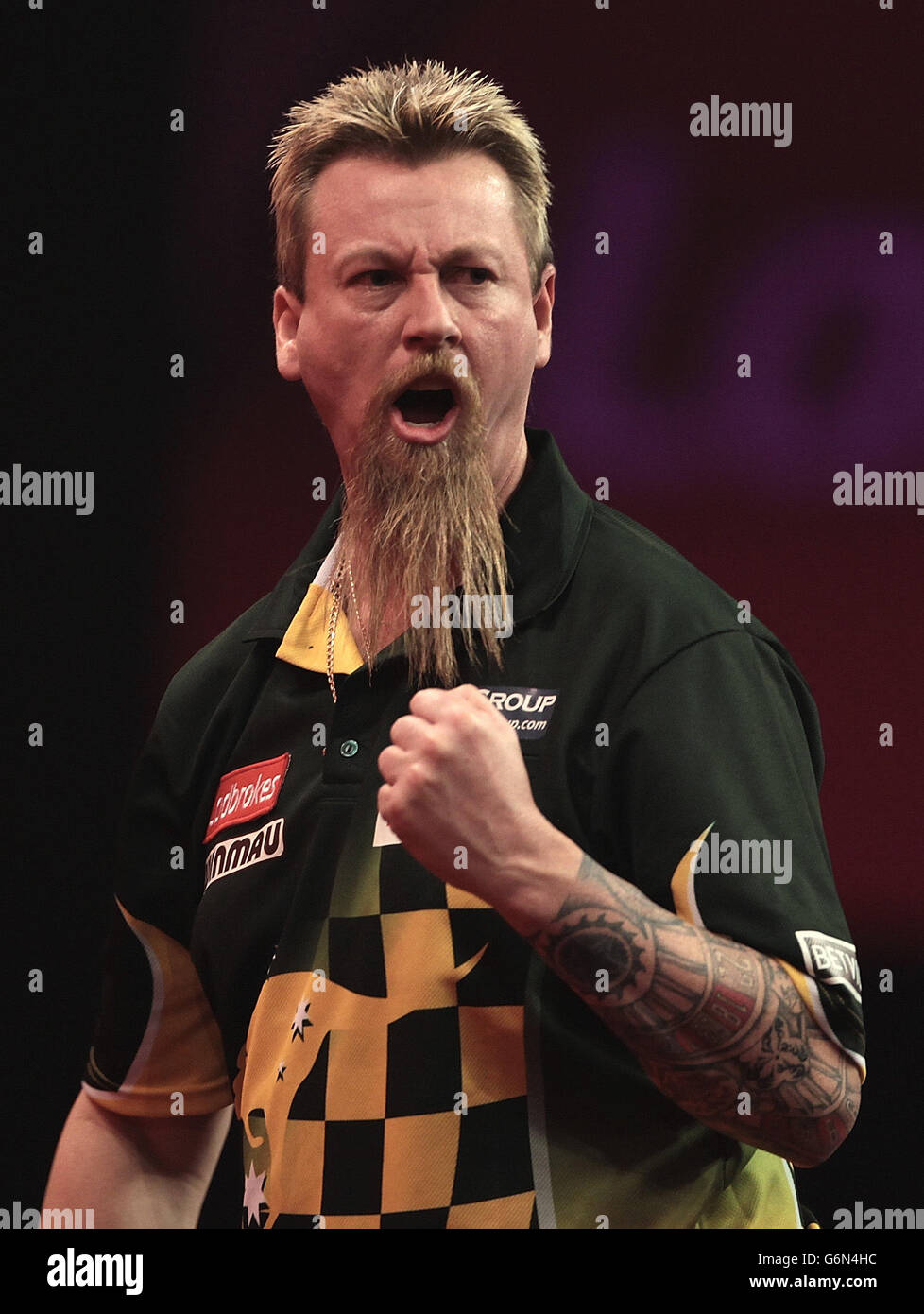 Simon Whitlock celebrates a 180 against Kevin Painter during the third ...