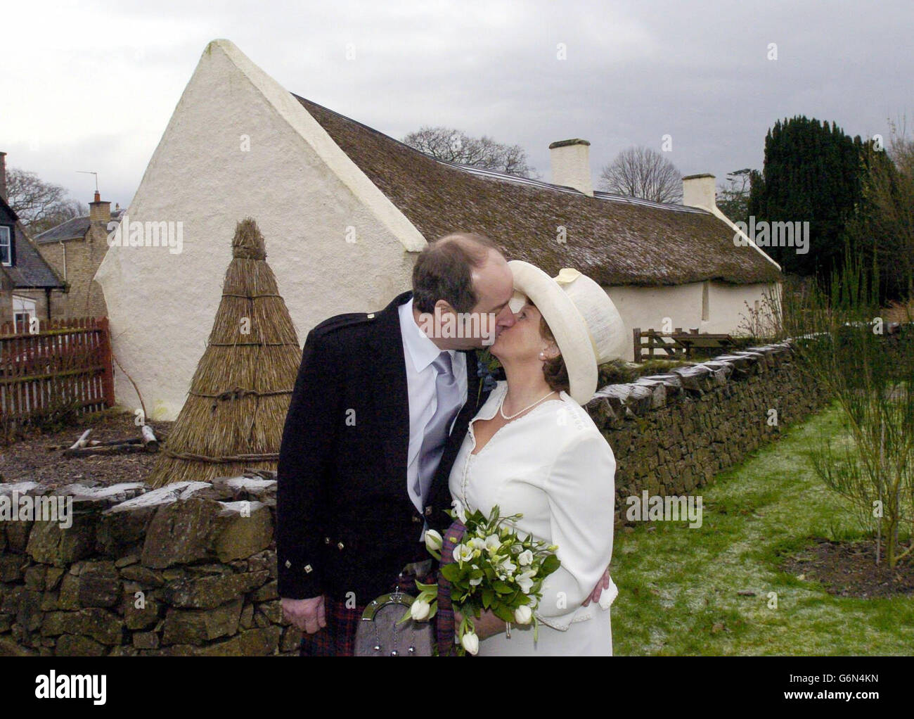 David MacDonald and his bride Sheila McNaughton smile after getting ...