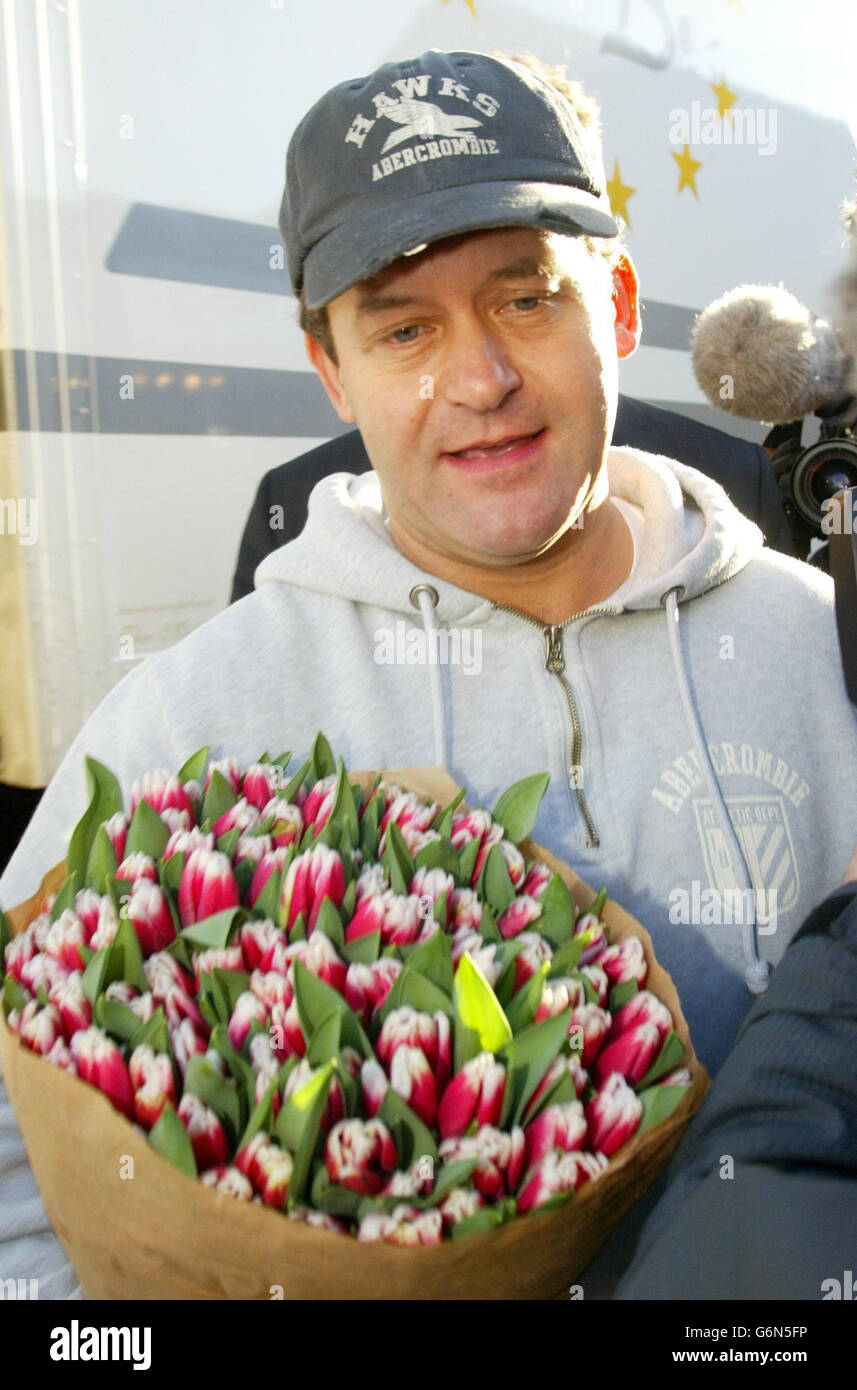 Former royal butler Paul Burrell carries a delivery outside his flower ...