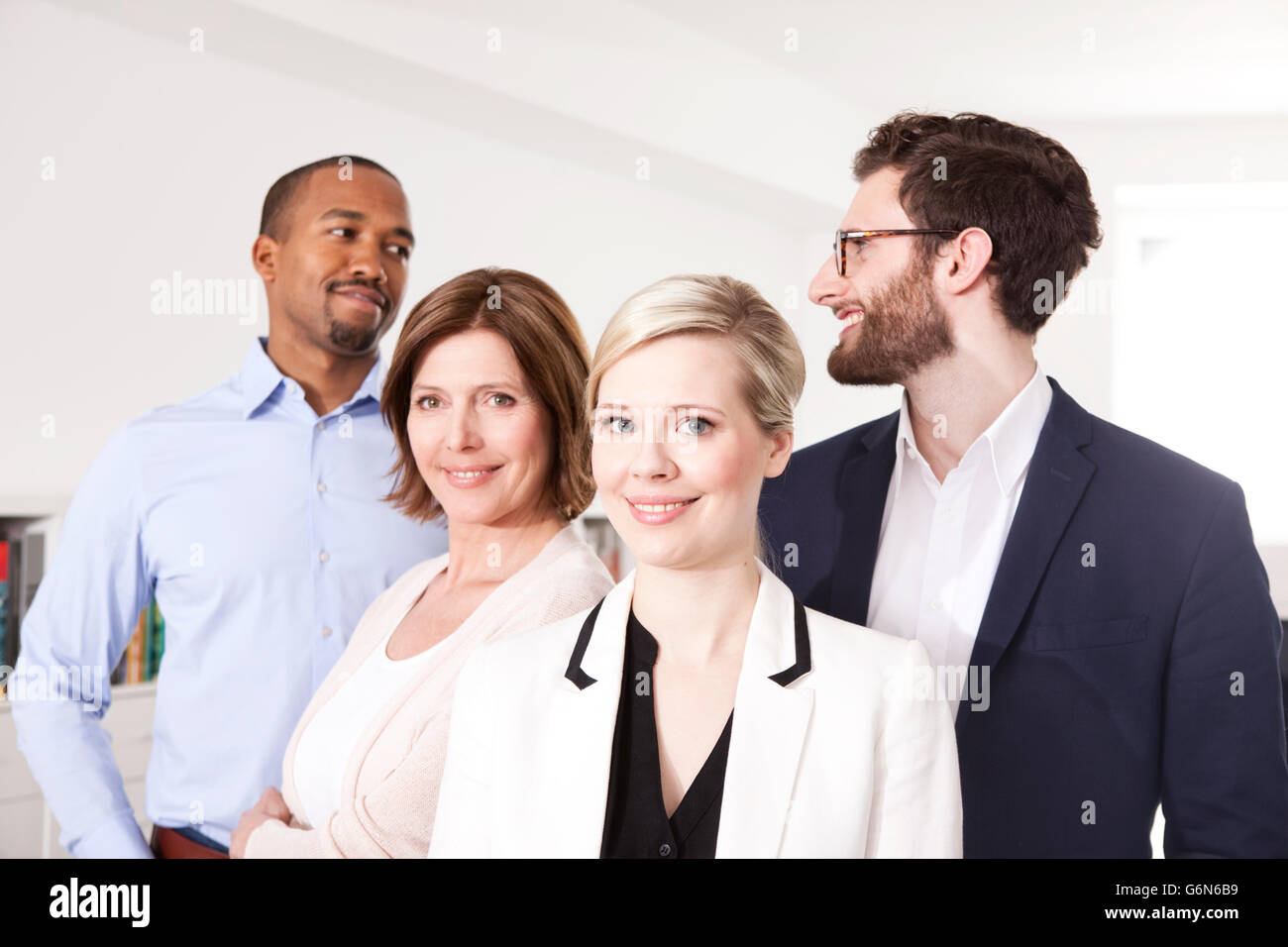 Team of four hi-res stock photography and images - Alamy