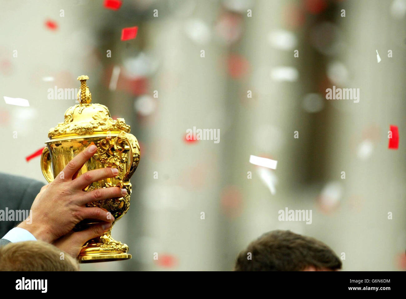 The Webb Ellis trophy is held aloft, as England's World Cup-winning ...