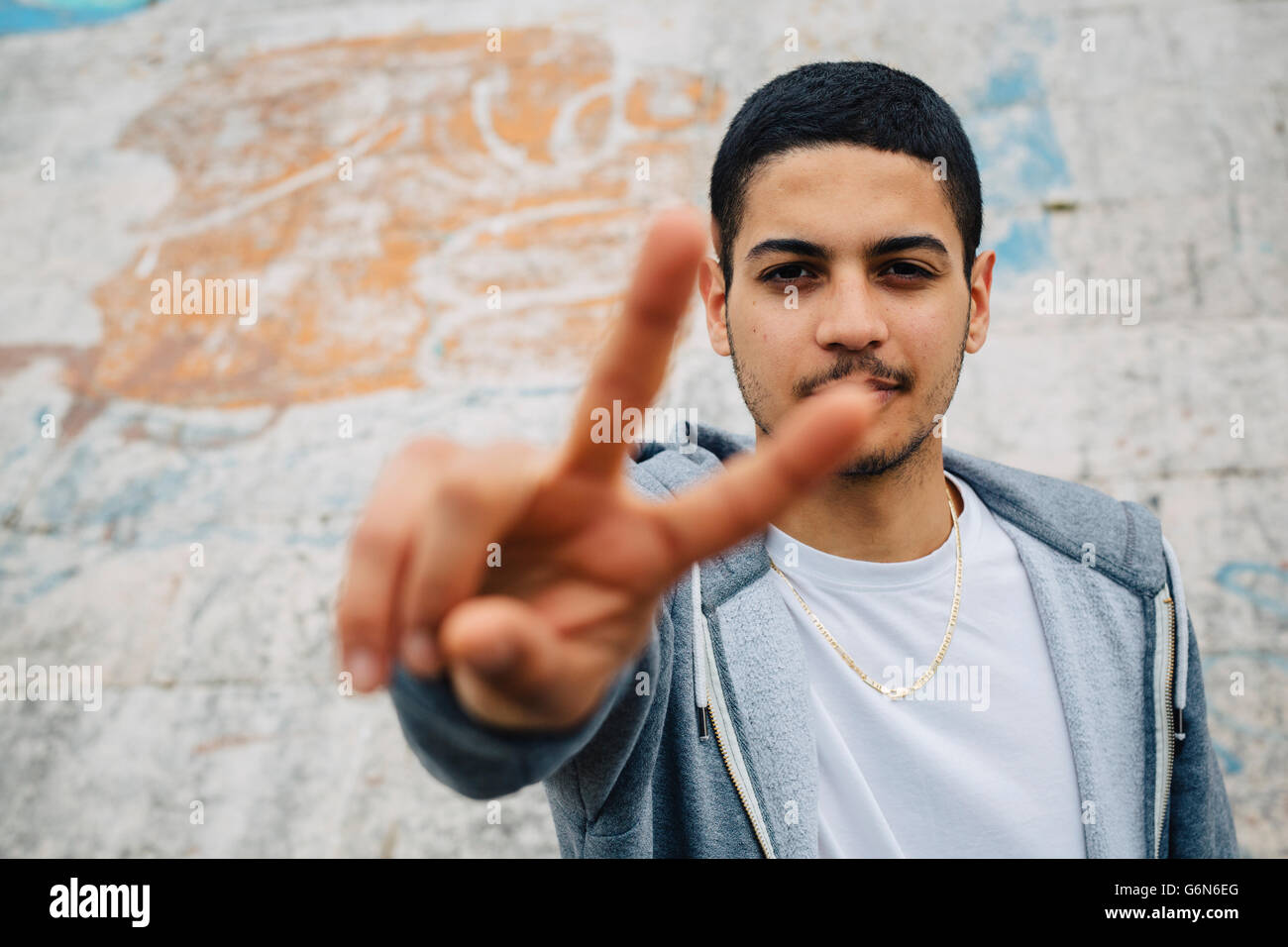 Outdoor portrait man victory sign hi-res stock photography and images ...