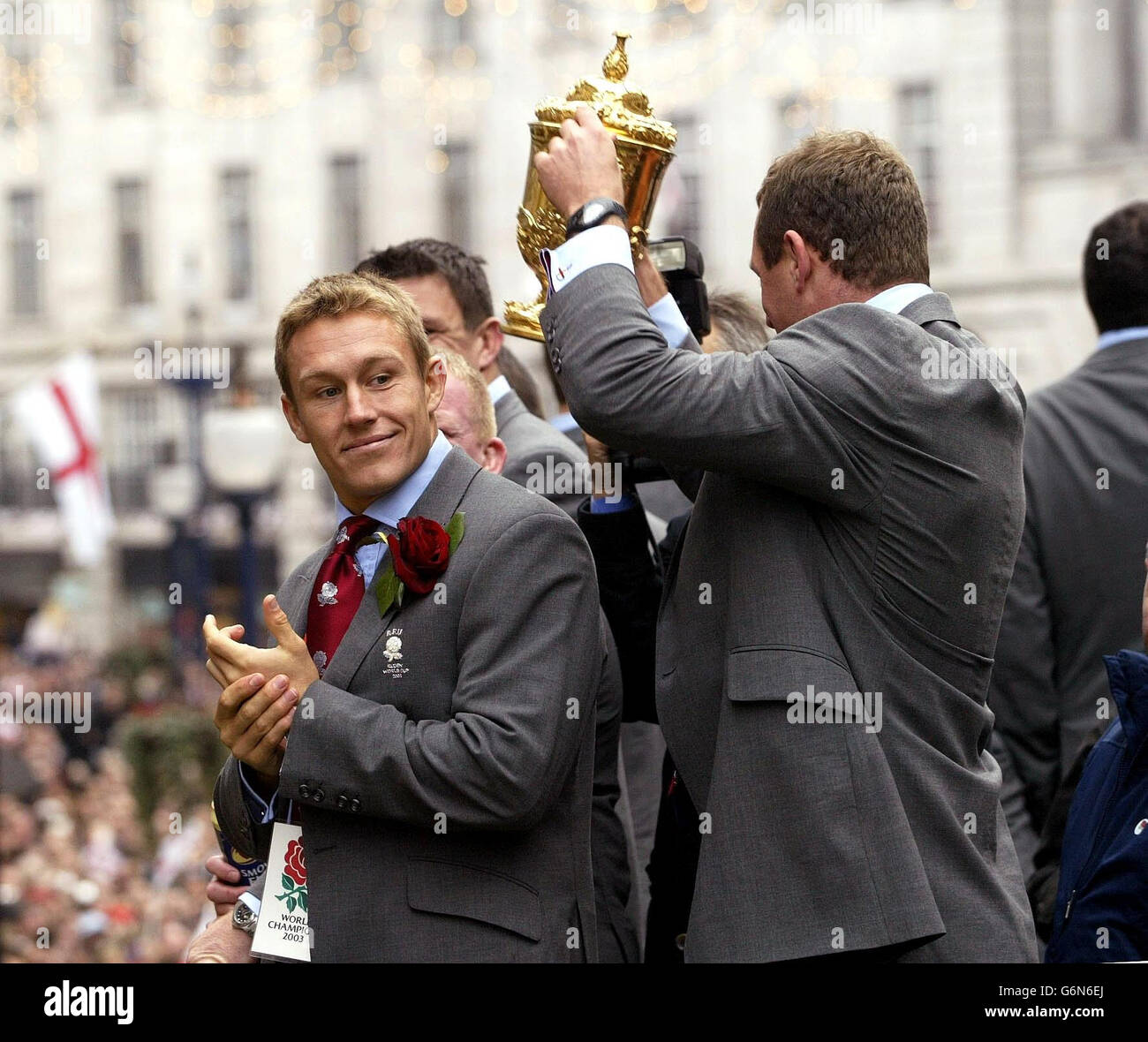 England's Richard Hill holds up the Webb Ellis Cup as Jonny Wilkinson ...