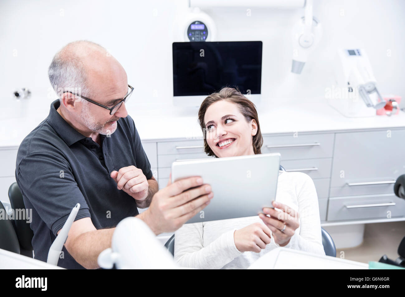 Young woman consulting dentist Stock Photo - Alamy
