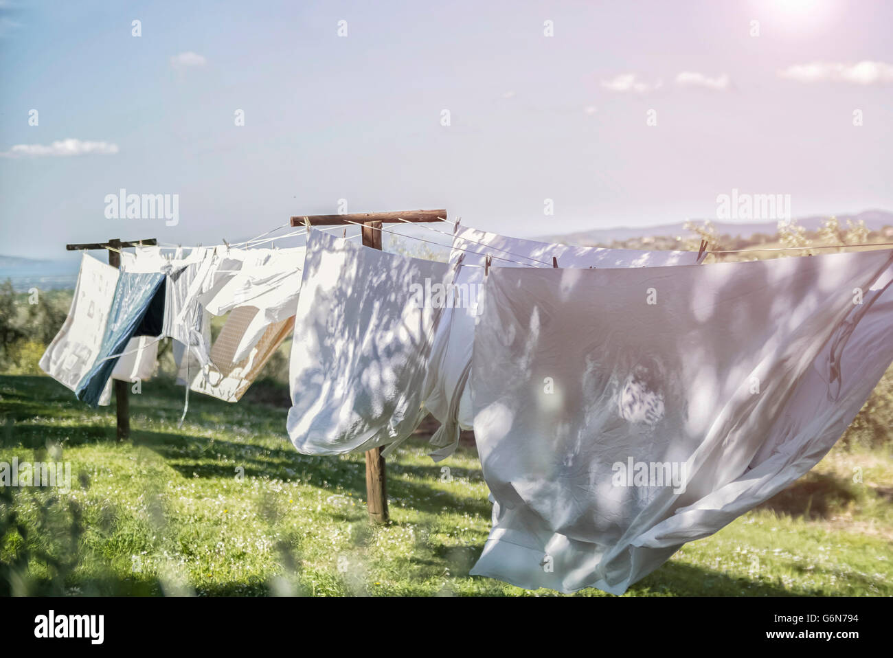 Italy, laundry drying on washing line Stock Photo - Alamy