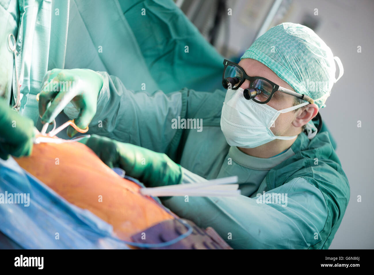 Heart surgeon during a heart operation Stock Photo - Alamy