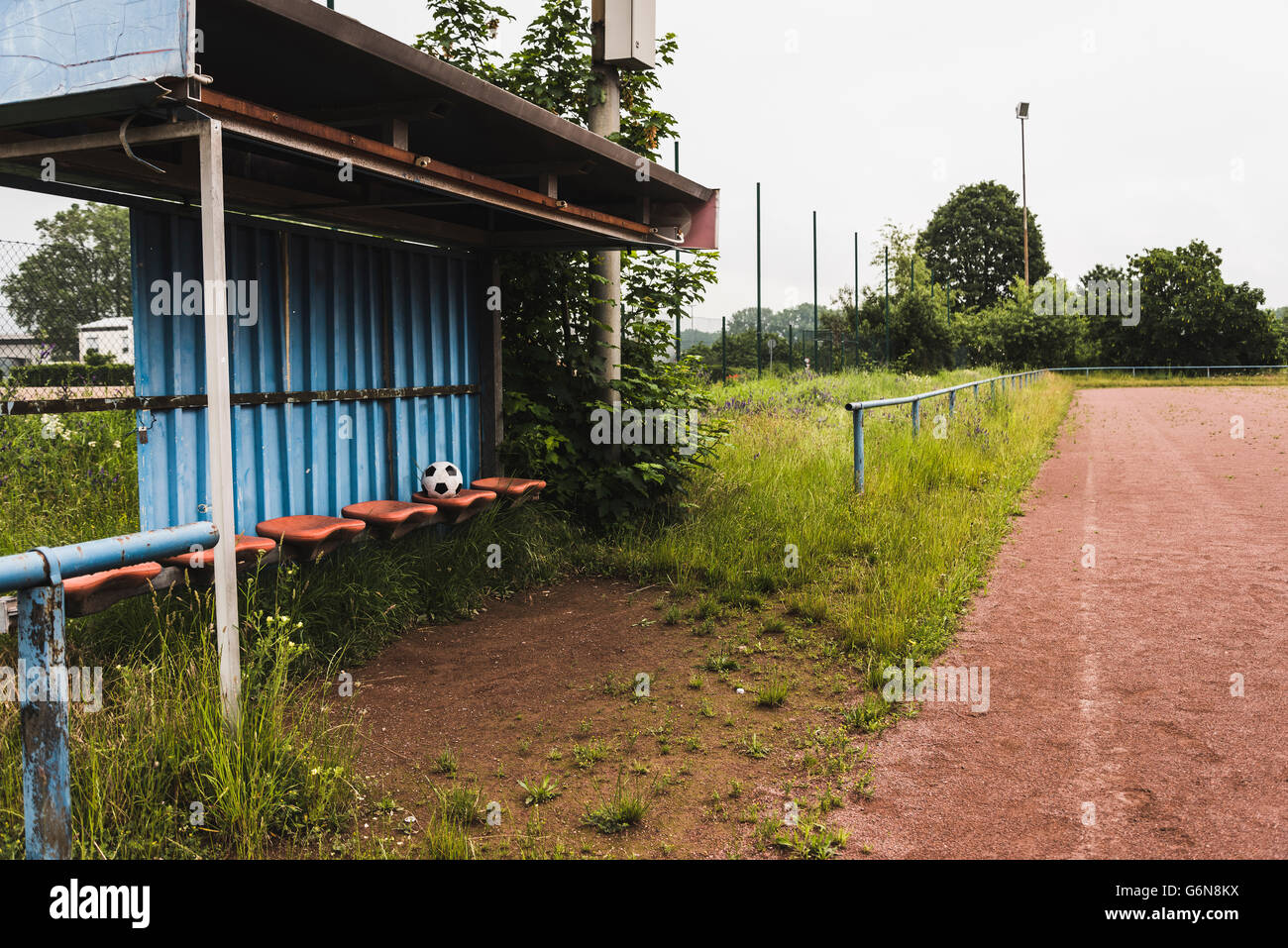 Empty coaching bench at soccer field Stock Photo - Alamy