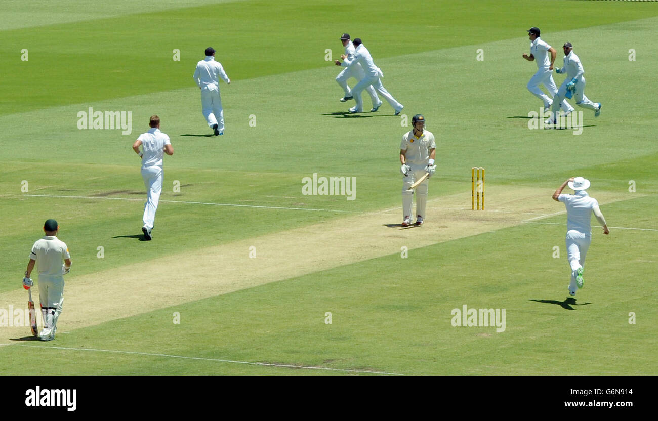 England's Stuart Broad and Graeme Swann celebrate taking the wicket of ...