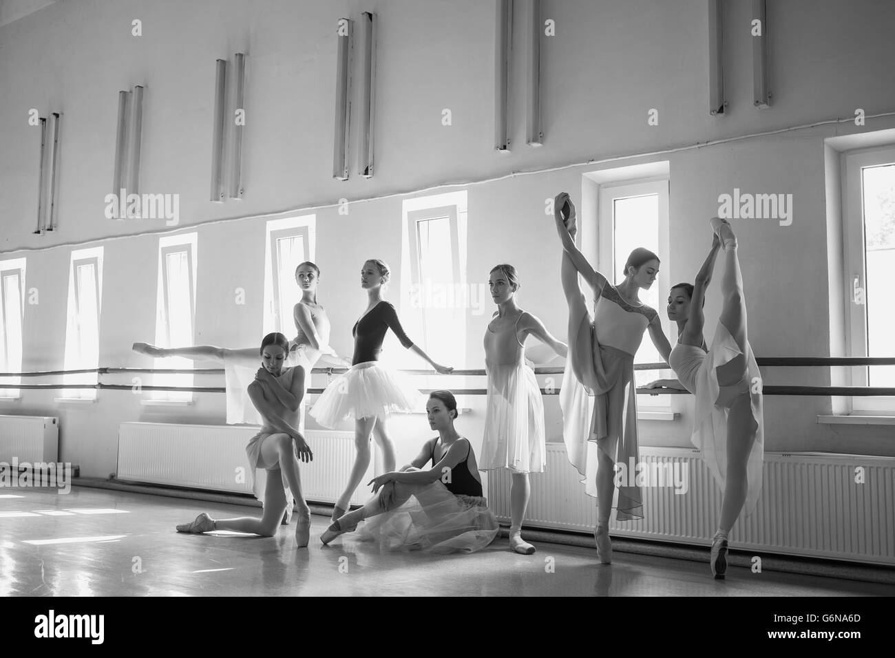 The seven ballerinas at ballet bar Stock Photo - Alamy