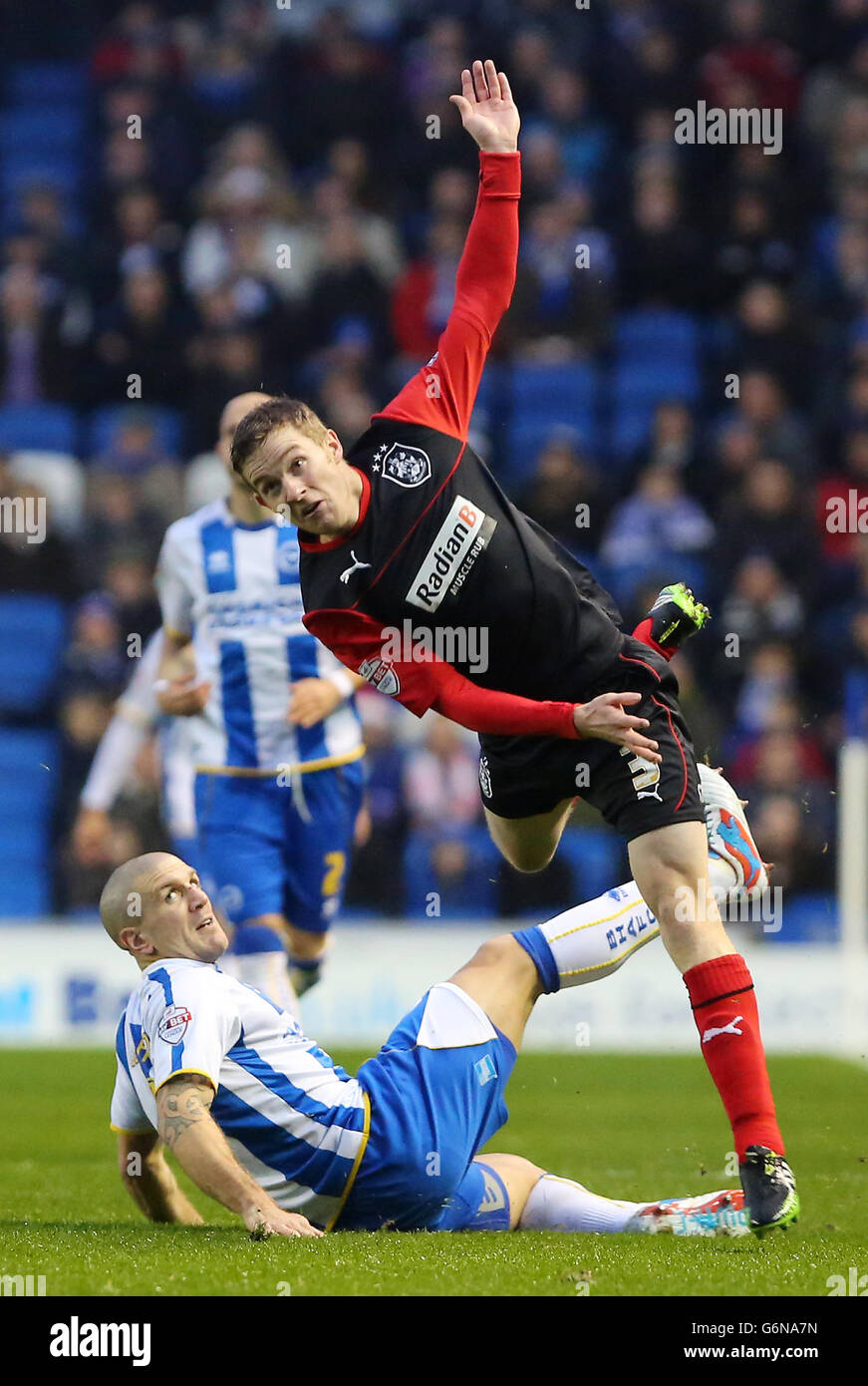 Brighton's Adam El-Abd (left)challenges Huddersfield's Paul Dixon ...