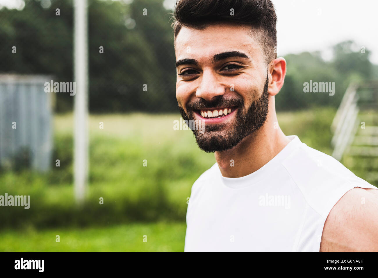 Portrait of smiling athlete outdoors Stock Photo - Alamy