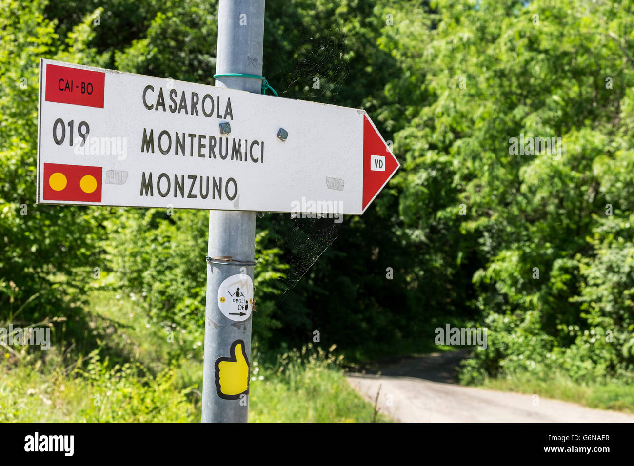 Red and white signs pointing the way on the walking route of the Via ...