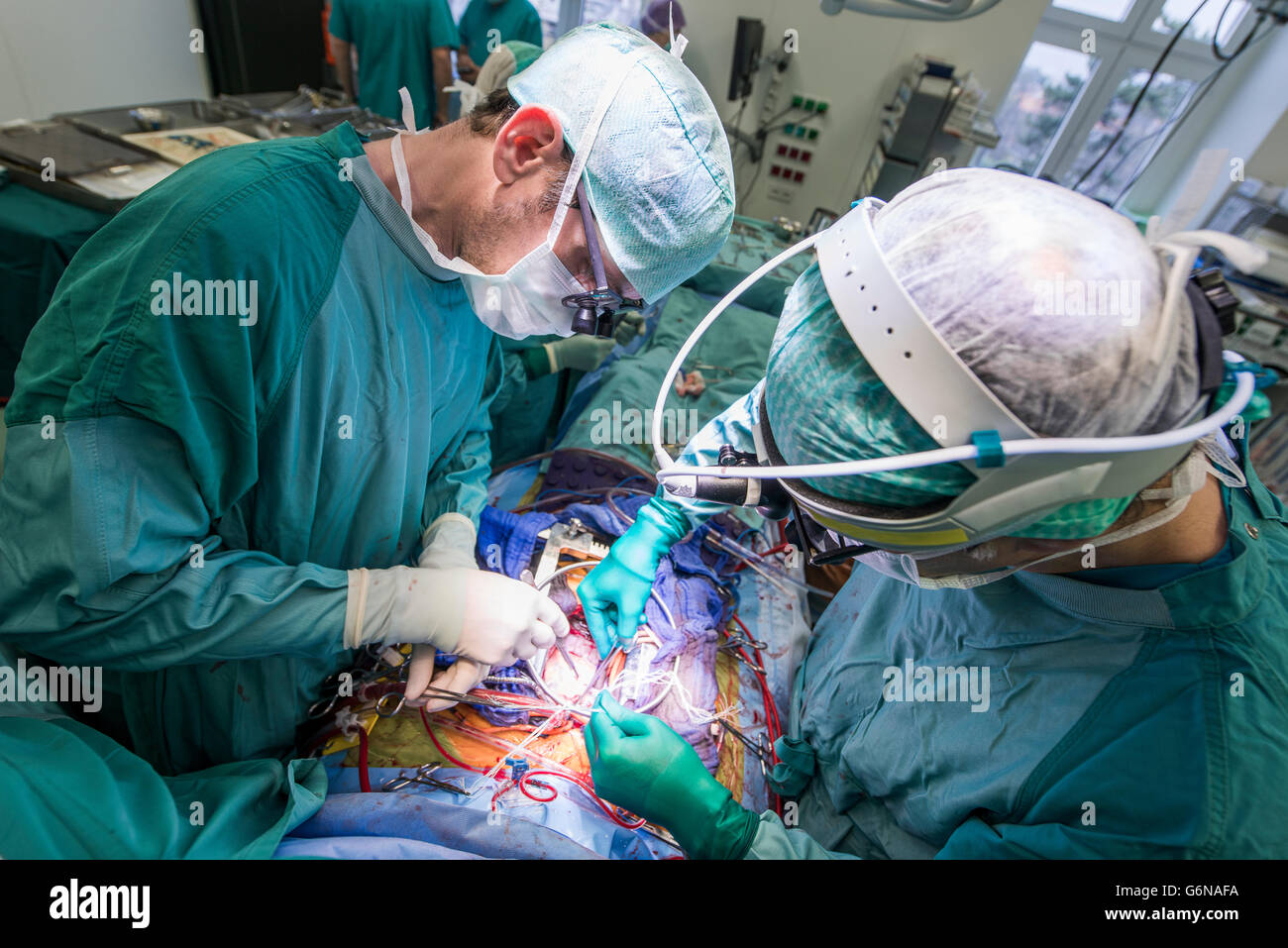 Heart surgeons during a heart valve operation Stock Photo - Alamy