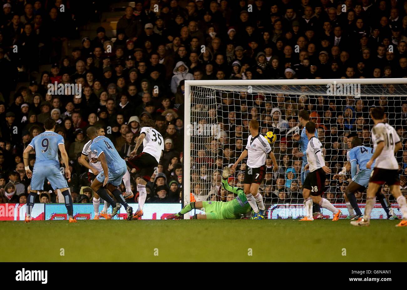 Manchester City's Vincent Kompany (4) scores his team's second goal ...